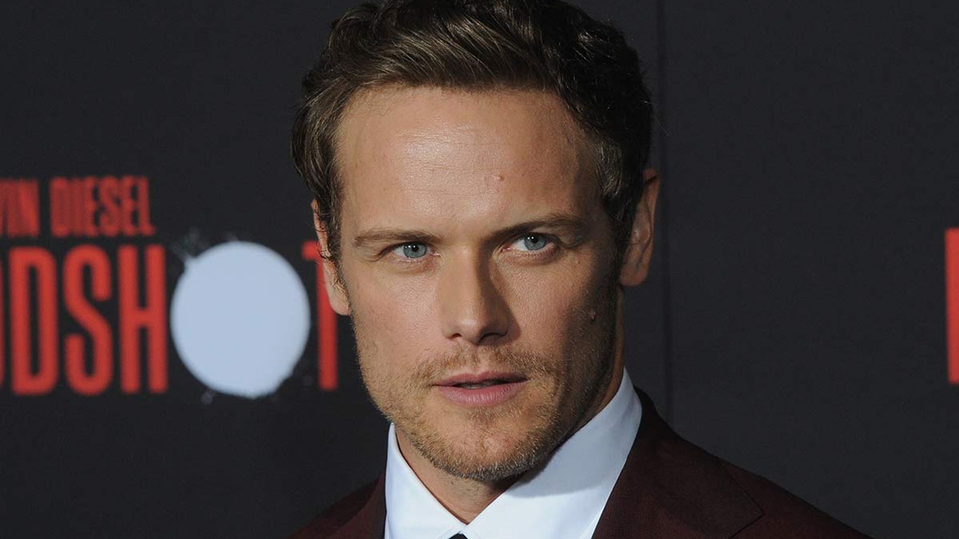 Outlander's Sam Heughan sparks fan frenzy in muscle fit T-shirt for new ...