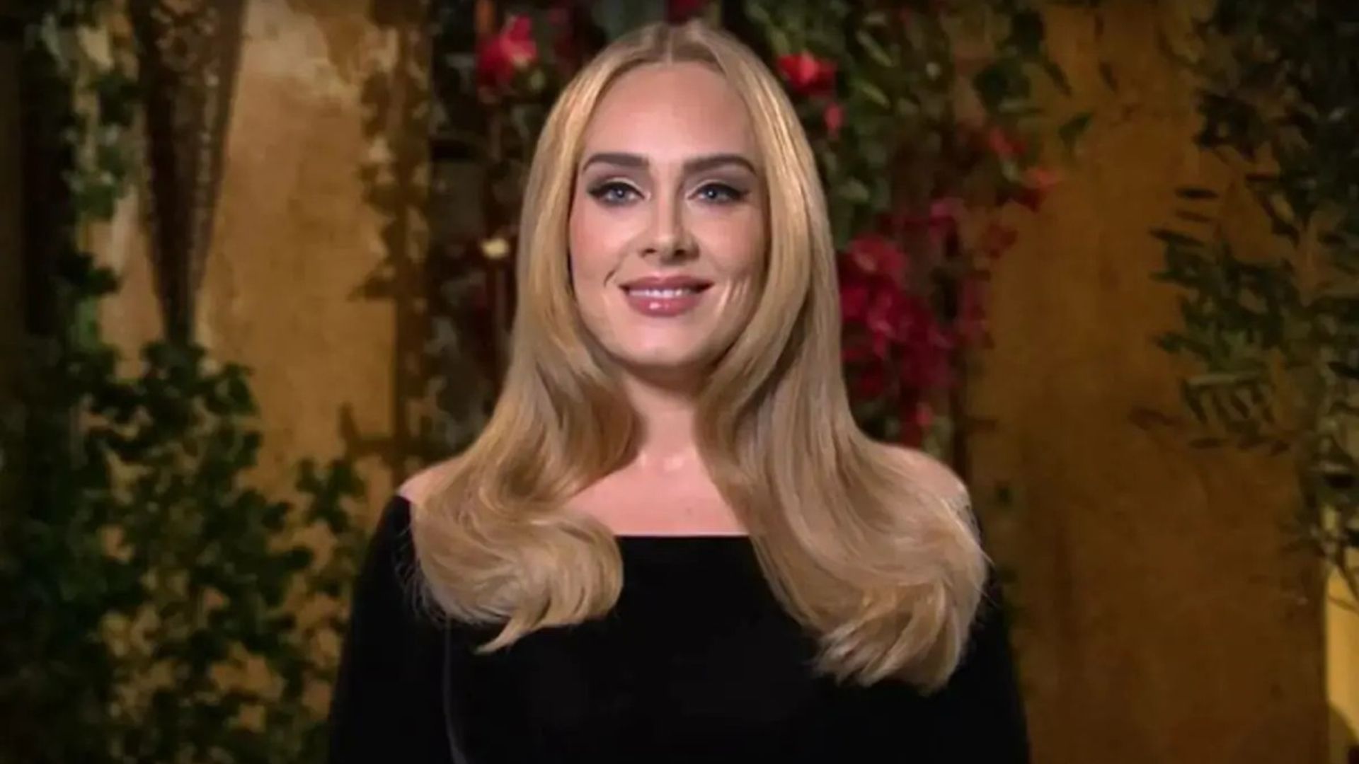 Adele looks flawless in deep-V knit and bouncy blow-dry for stunning ...