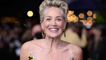 Sharon Stone, 63, stuns in a figure-hugging black dress with a very ...