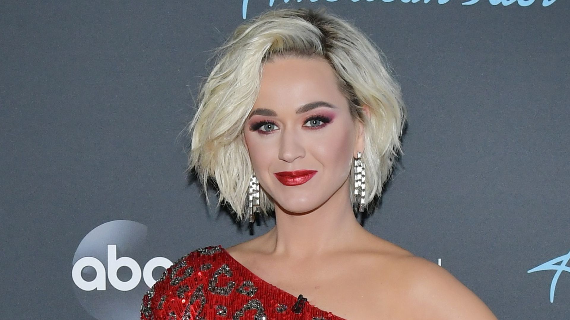 Katy Perry dazzles in a shimmering figure-hugging catsuit to announce ...