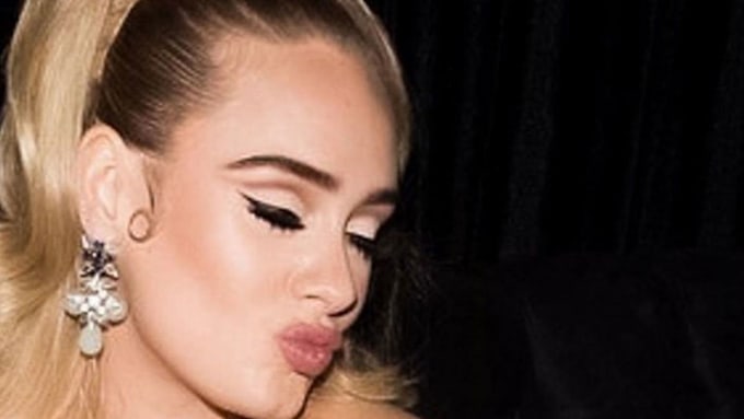 Adele wears daring mini dress as she celebrates album launch with ...