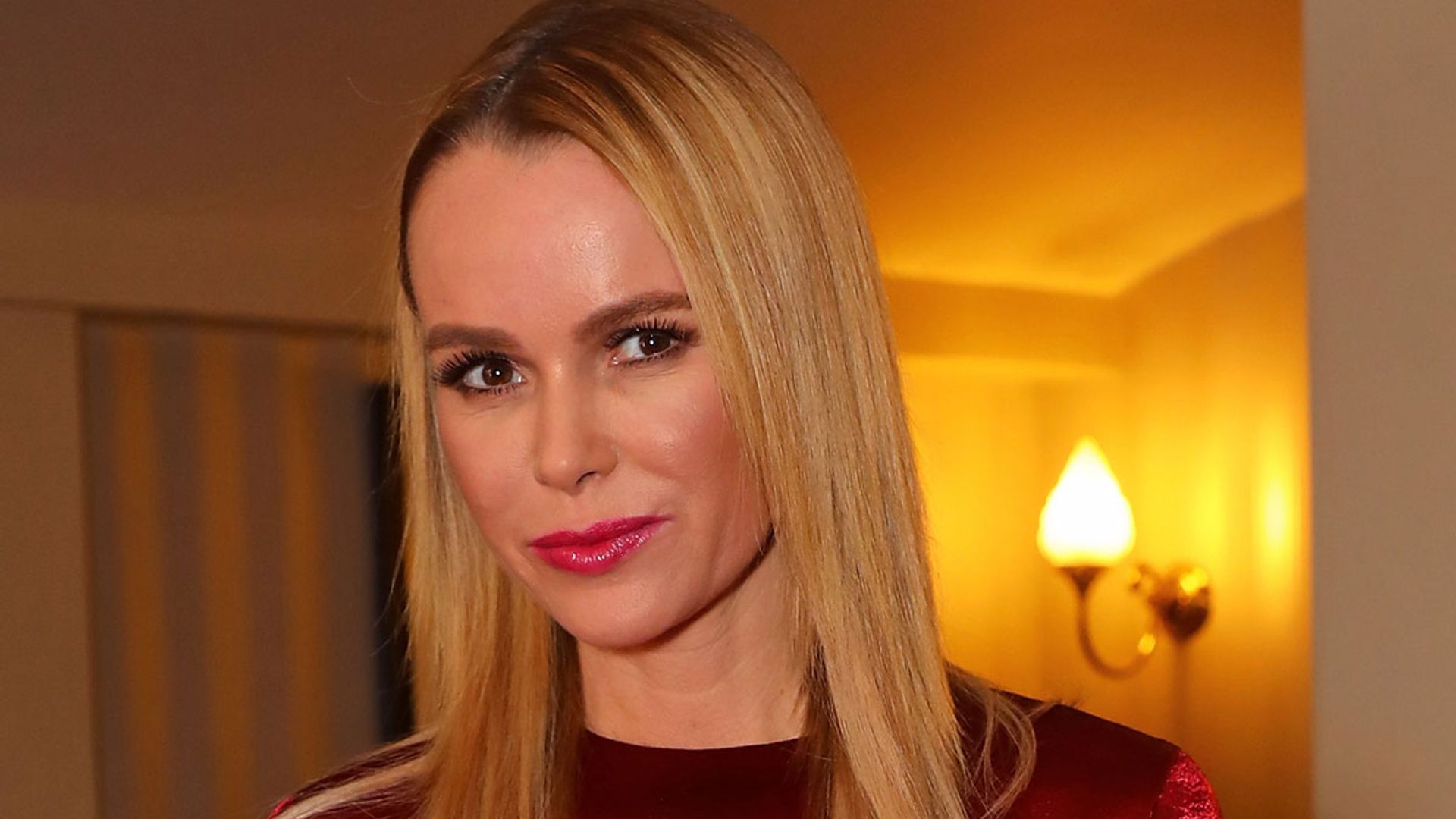 Amanda Holden poses in silky off-the-shoulder pyjamas | HELLO!