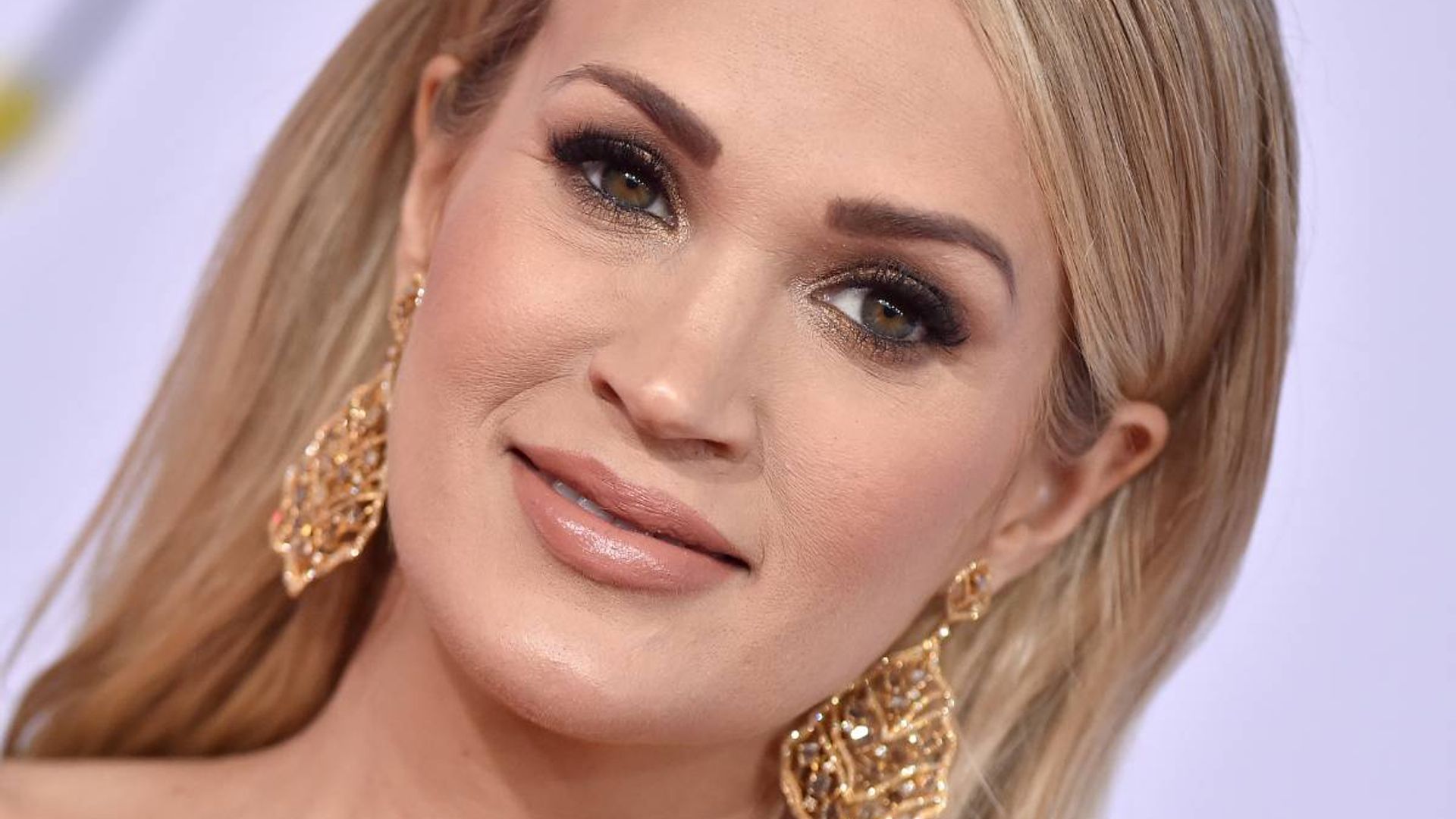 Carrie Underwood looks unreal in sheer low-cut red dress as she ...