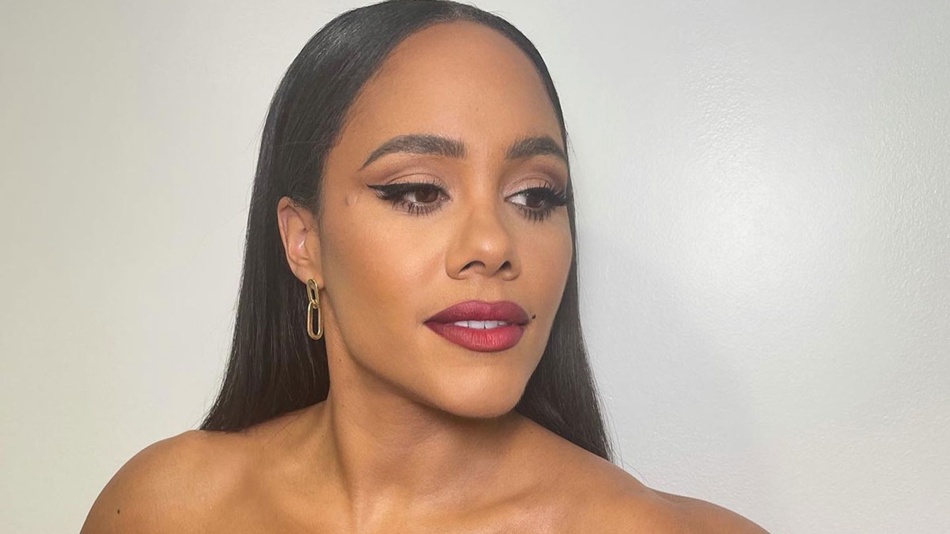 Alex Scott displays endless legs in mini dress and heels to mark ...