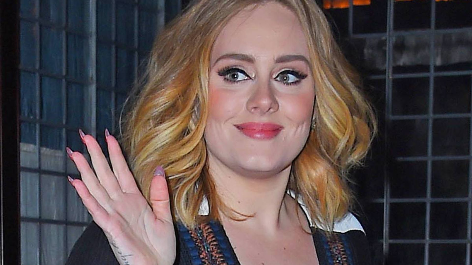 Adele showcases toned legs in leather mini skirt and figure-hugging ...