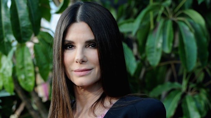 Sandra Bullock dons jaw-dropping gown with plunging neckline and high ...