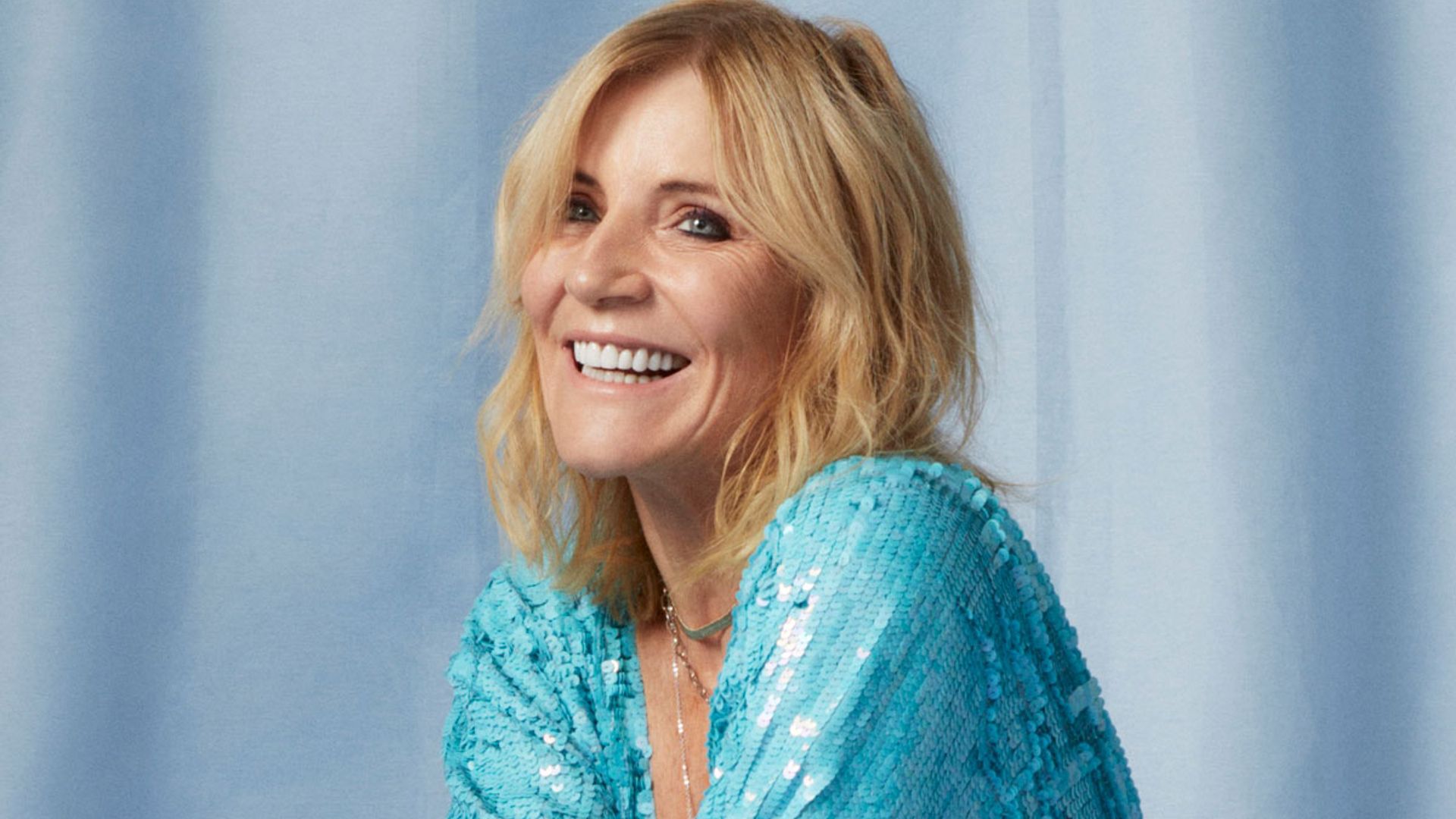 EastEnders star Michelle Collins sparkles in plunging dress for special ...