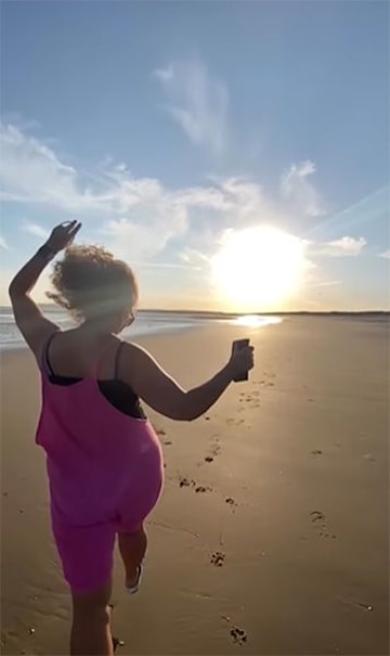 Loose Women's Nadia Sawalha is a beach goddess as she frolics in the ...
