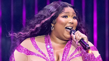 Lizzo drops jaws in thigh-high boots and leotard after Kanye West's weight jibe | HELLO!