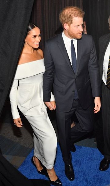 Meghan Markle causes a stir in elegant gown with daring slit for extremely rare red carpet ...