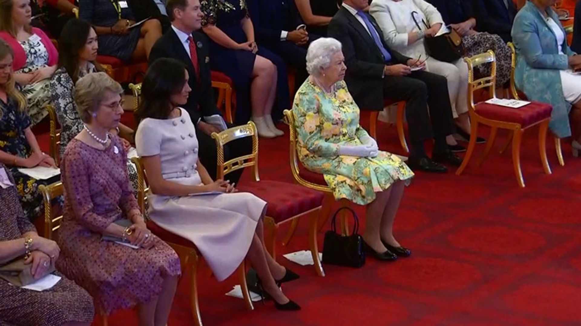 Meghan Markle wears Prada while hosting awards ceremony alongside the ...