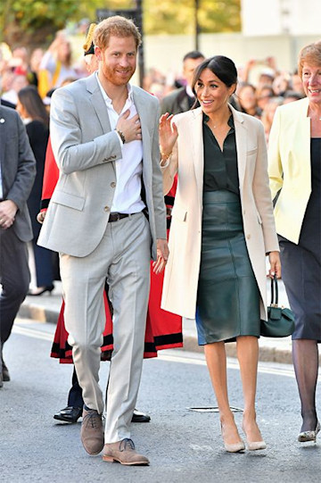 Meghan Markle stuns in a cream coat and a gold signet ring by Missoma ...