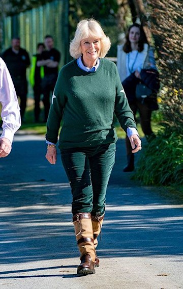 Duchess Camilla surprises in bold trousers and knee-high boots | HELLO!