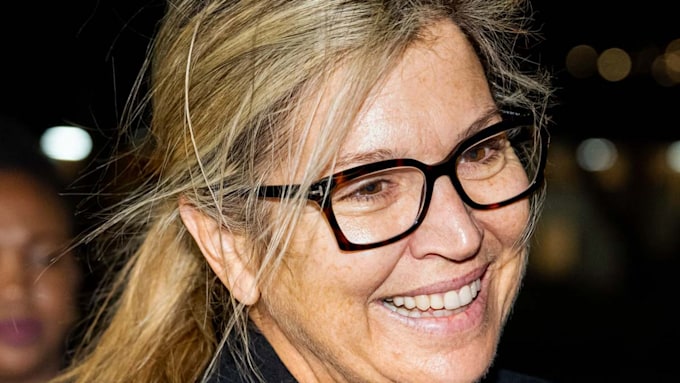 Queen leaves plane wearing unusual accessory and royal fans have ...