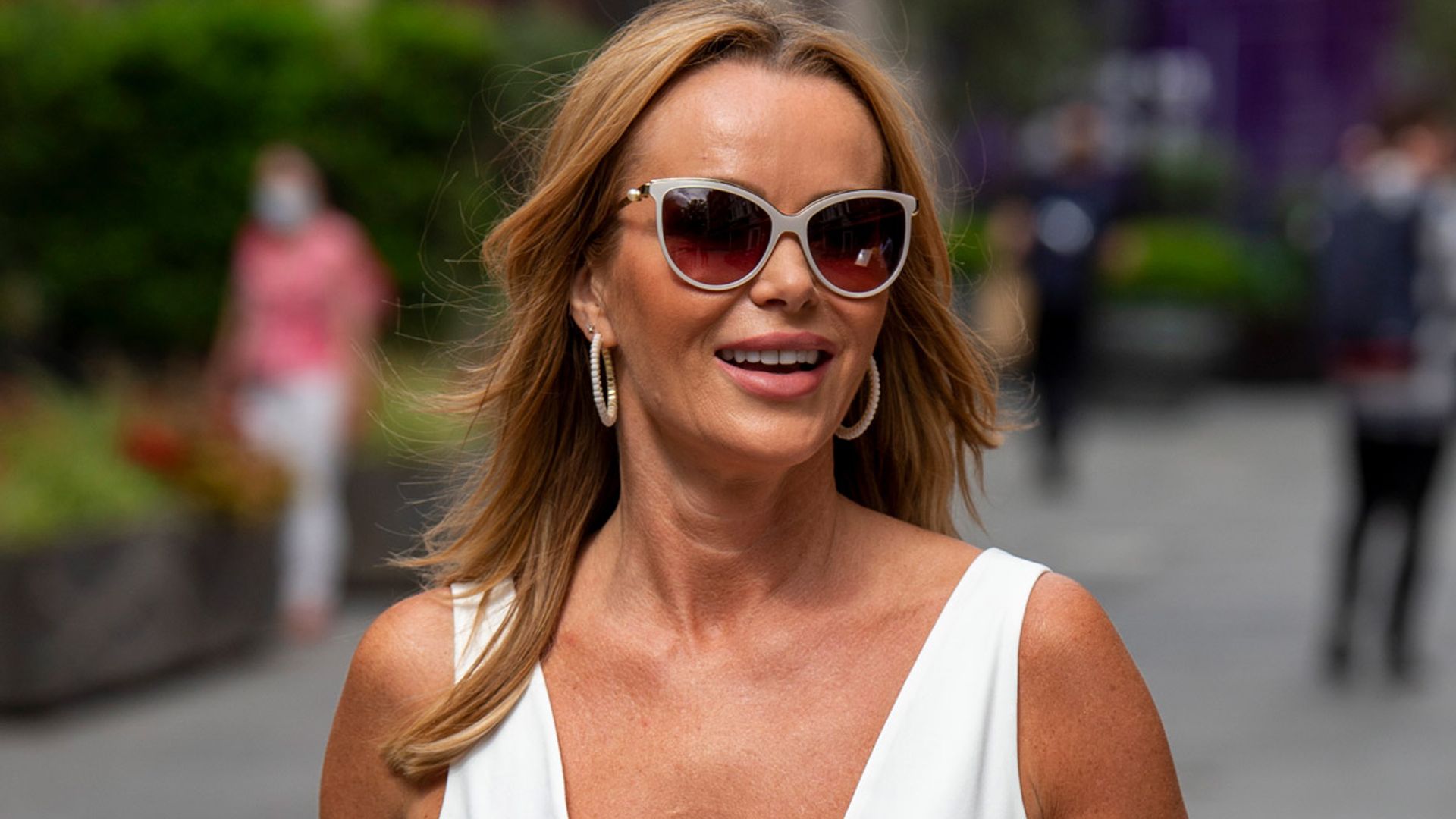 Amanda Holden wears nothing but a slinky swimsuit for swim in freezing ...