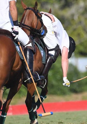 Prince Harry worries fans as he falls off his horse during polo match ...