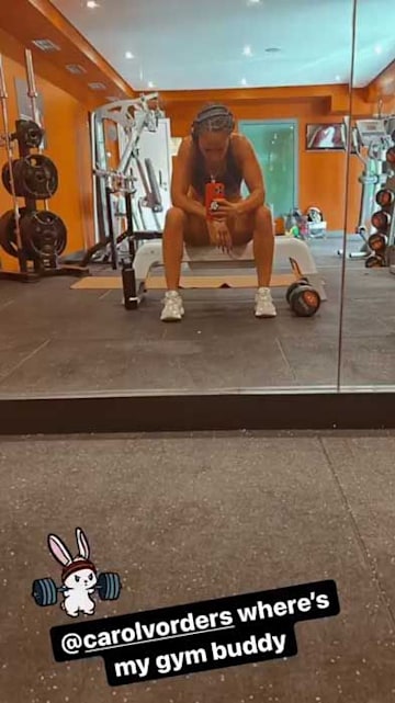 Alex Scott rocks crop top as she works up a sweat with Carol Vorderman ...