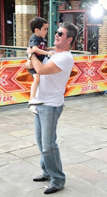 Simon Cowell's son Eric looks so grown up on royal-approved holiday ...