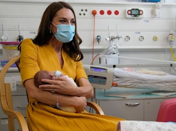 Broody Kate Middleton carefully cradles tiny new baby | HELLO!