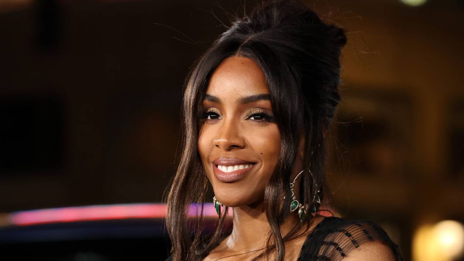 Kelly Rowland wows in sheer kaftan as she lounges by the pool in jaw ...