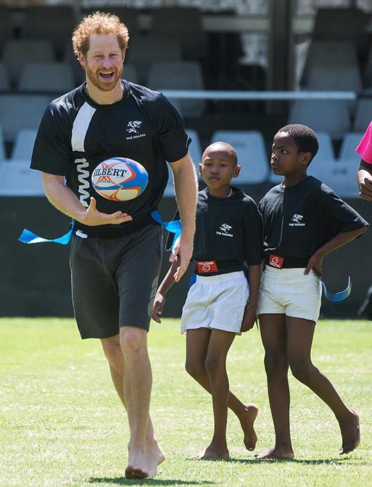 Prince Harry shows off his rugby skills during South Africa visit | HELLO!