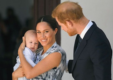 Pregnant Meghan Markle carries grown-up Archie over growing baby bump ...