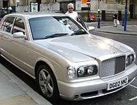 Leather leggings and a trilby hat for Posh for flight | HELLO!