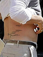 Brad's latest tribute tattoo revealed in gust of wind at | HELLO!