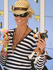 Elle all smiles as she takes time out Down Under | HELLO!